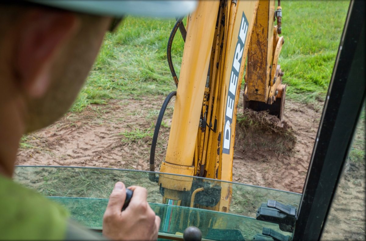 Backhoe Operator in Action - Index AR Solutions